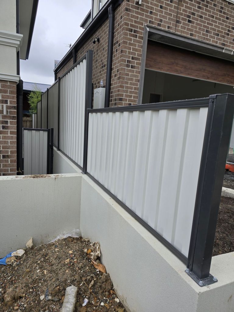 Colorbond fencing on retaining wall - Anjo's Fencing